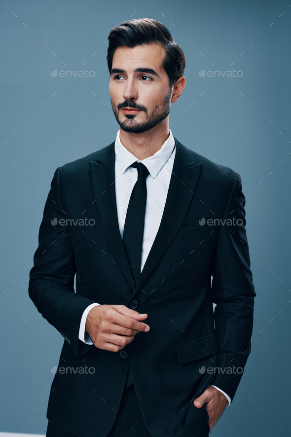 Business man in business suit businessman poses on blue background ...