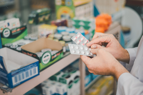 Pharmacist checking Checks Inventory of Medicine, Drugs, Vitamins and ...