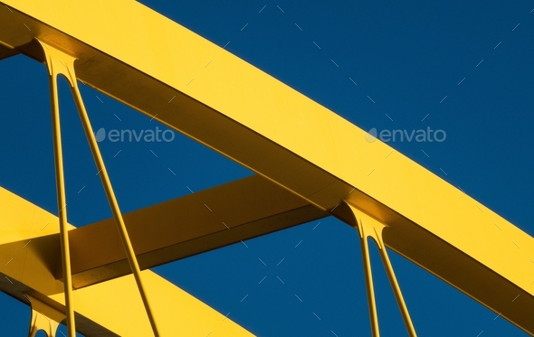 Fragments of a modern yellow construction with a blue background Stock ...