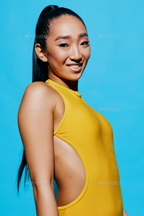 Trendy woman surprised happy blue fashion yellow beauty lifestyle smile portrait Stock Photo by ...