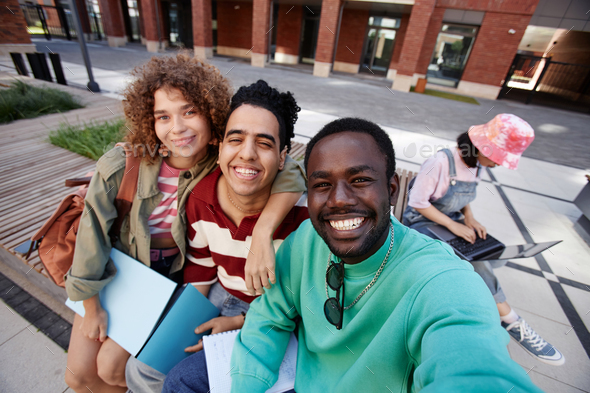 POV of young students taking selfie photo together and smiling at ...