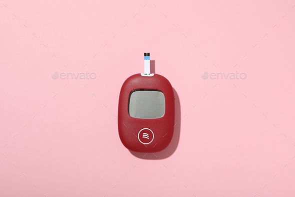 Red glucometer on pink background, top view Stock Photo by AtlasComposer