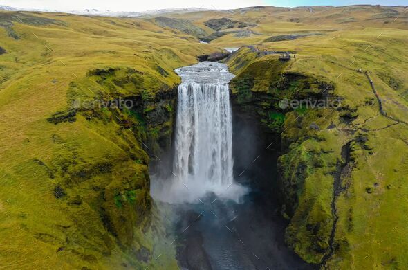 Mesmerizing aerial view of Skogafoss waterfall captured during daylight ...