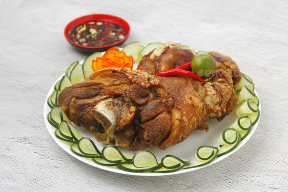 Freshly cooked Filipino food called Crispy Pata Stock Photo by junpinzon