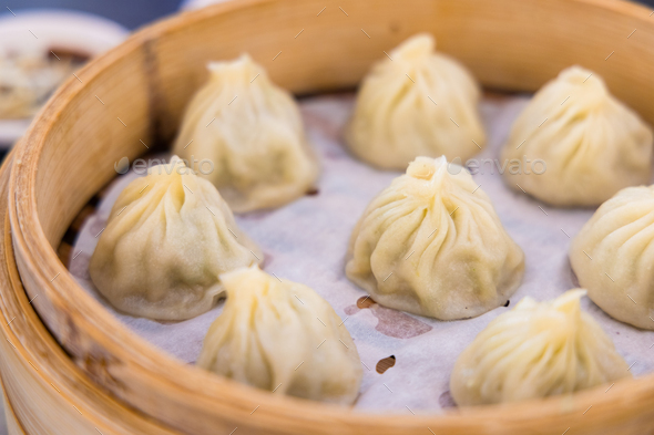 Chinese style steamed soup bun in restaurant Stock Photo by leungchopan