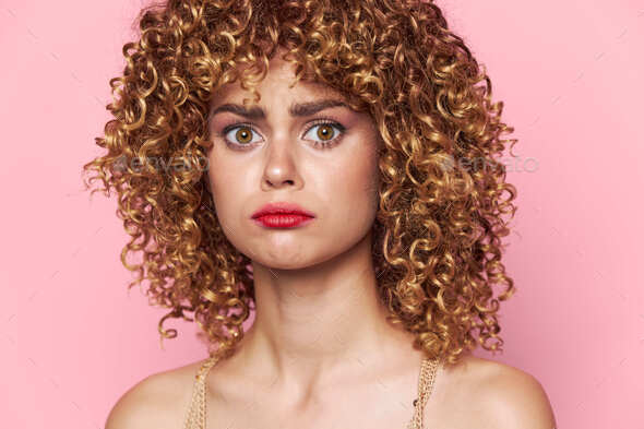 Lady curly hair Sad look red lips close-up pink background Stock Photo ...