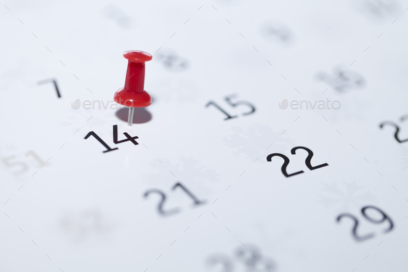 Red pin fixed on the 14th day of a month on a calendar Stock Photo by ...