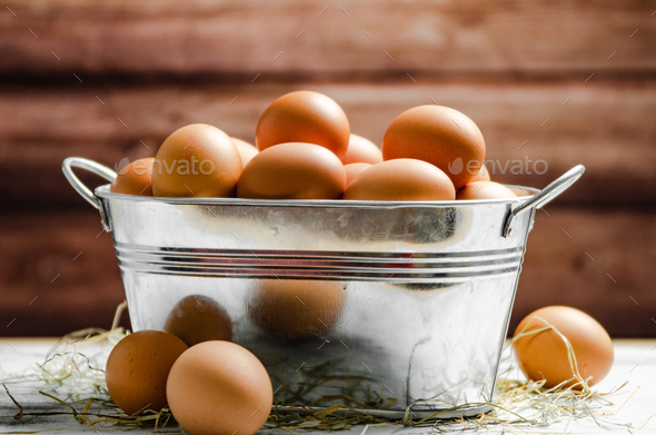 Fresh chicken eggs in bucket. Stock Photo by Artem_ka2 | PhotoDune