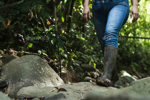 medium shot of a peasant girl's feet, walking along a stone path in the ...