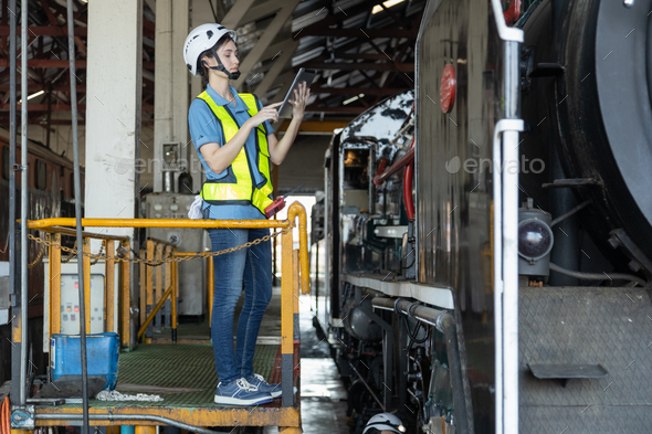Portrait of Engineer train Inspect the train's diesel engine, railway ...