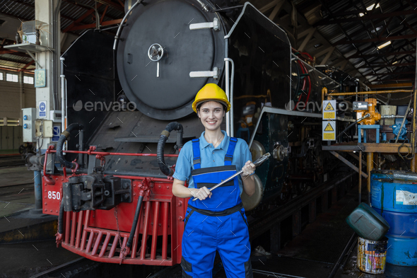 Portrait of Engineer train Inspect the train's diesel engine, railway ...