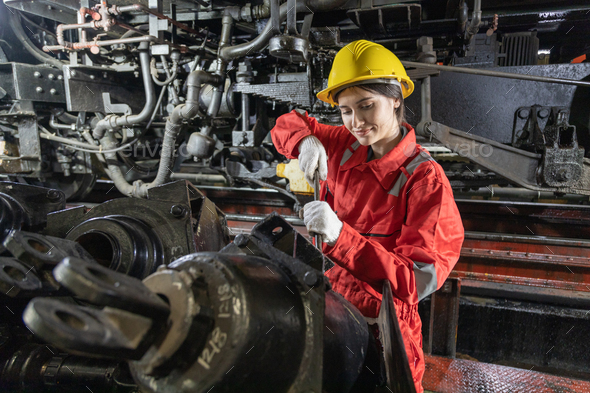 Portrait of Engineer train Inspect the train's diesel engine, railway ...