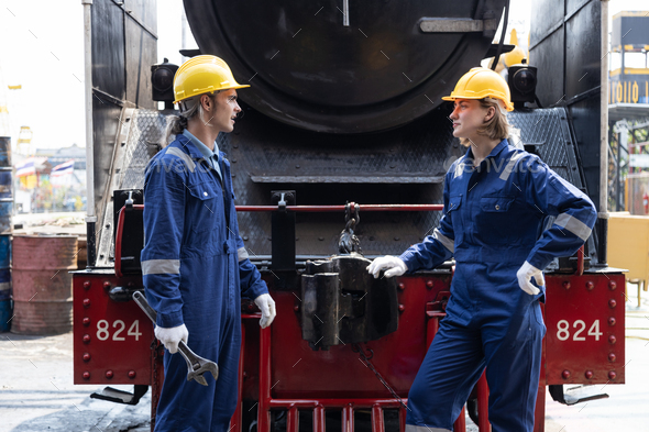 Portrait of Engineer train Inspect the train's diesel engine, railway ...