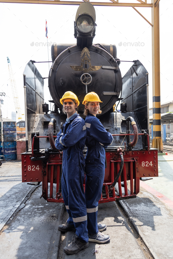Portrait of Engineer train Inspect the train's diesel engine, railway ...