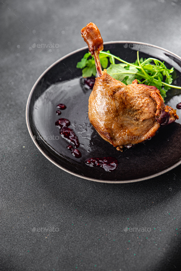 fresh duck leg confit berry sauce poultry meat eating cooking appetizer ...