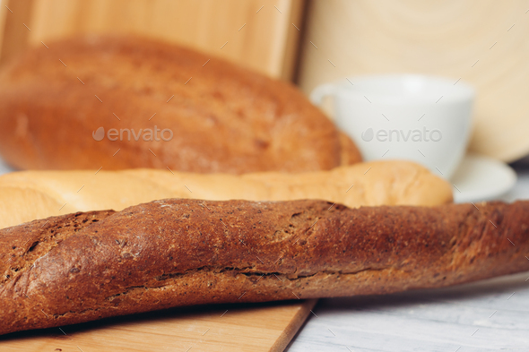 different types of loaves cutting board kitchen cutting Stock Photo by ...