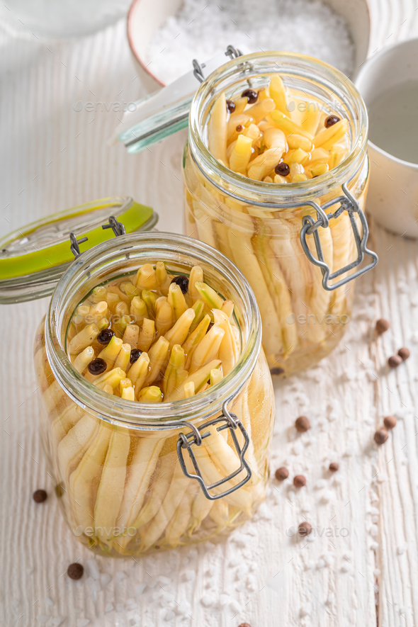 Homemade canned yellow beans with dill and galic. Stock Photo by Shaiith