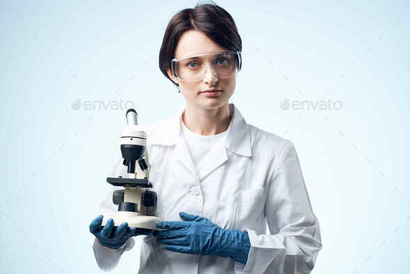 female doctor with microscope in hands technology research science ...