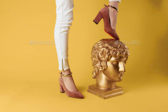 Female feet head sculptures golden color luxury fashion yellow ...