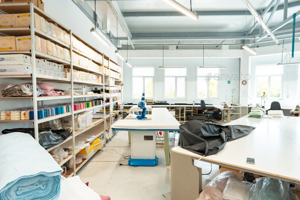 Interior of a sewing warehouse of furniture factory with equipment and ...