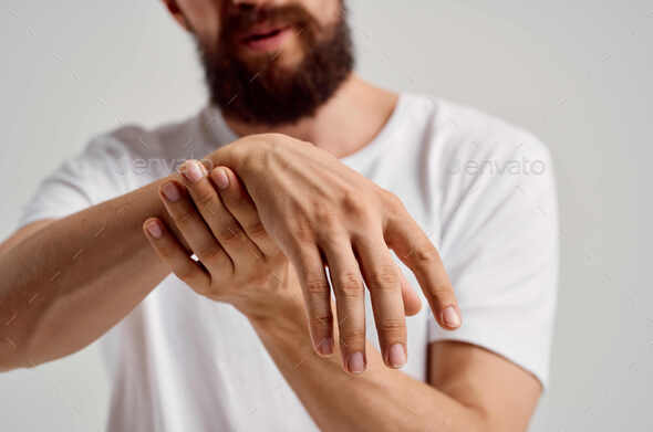 man holding hand injury pain health problem Stock Photo by shotprime
