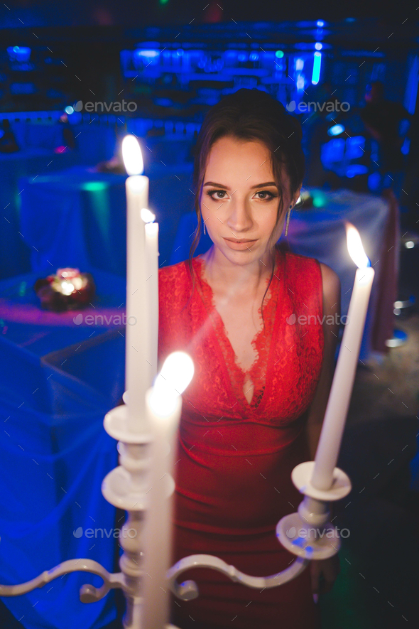 Pretty Caucasian lady wearing red evening dress and posing with white ...