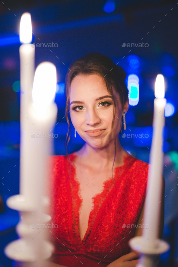 Pretty Caucasian lady wearing red evening dress and posing with white ...
