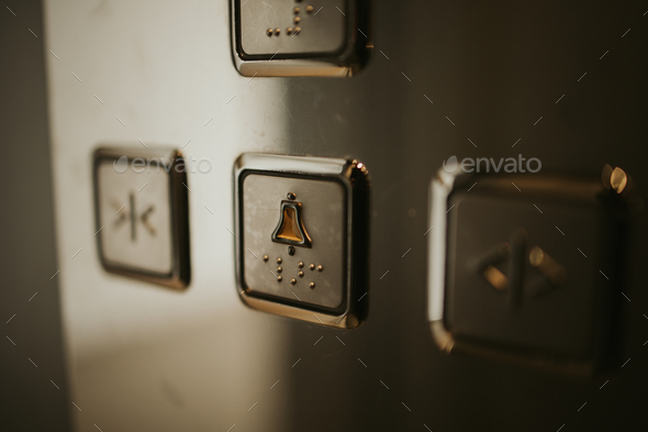 Elevator buttons with a focus on the alarm kno Stock Photo by wirestock