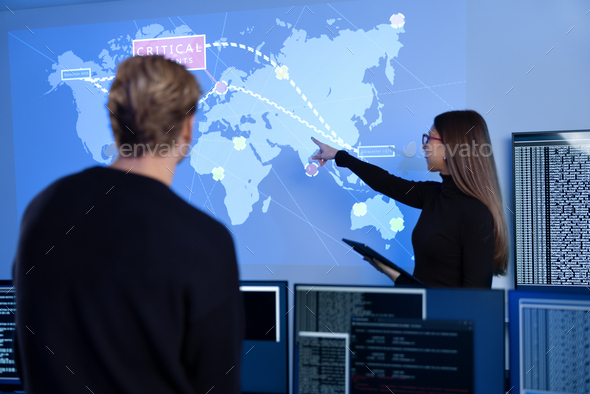 Professional cyber security team working to prevent security threats ...