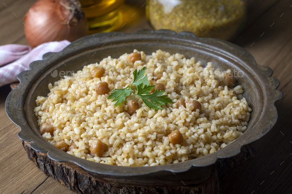 Traditional delicious Turkish food; bulgur pilaf with chickpea (Turkish ...