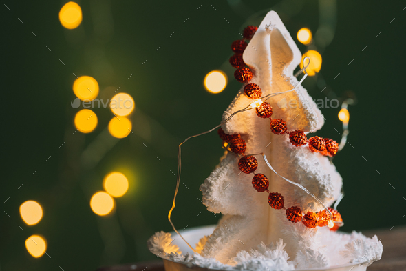White crystal grown Christmas tree shapes with red beads opposite ...