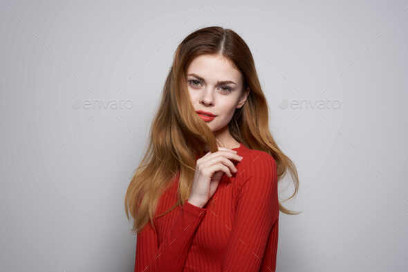 beautiful woman fashion hairstyle red sweater model light background ...