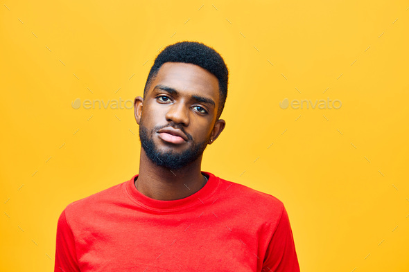 Happy young African American gen z guy isolated on beige background ...