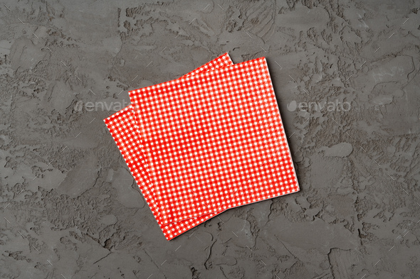 Stack of paper square napkins on gray background Stock Photo by ...