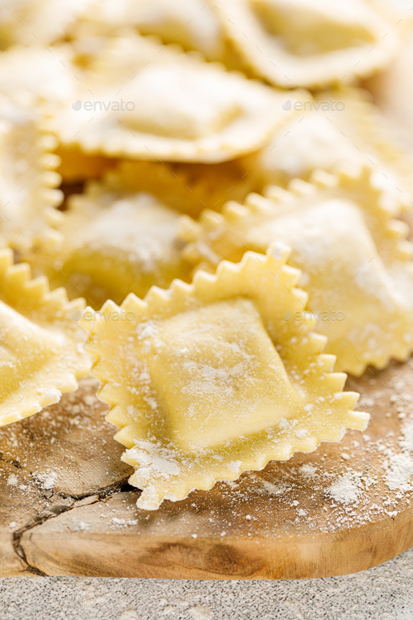 Cooking ravioli on a floured kitchen table Stock Photo by sea_wave