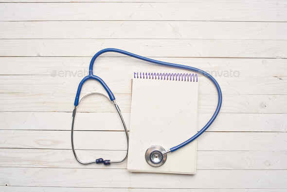 stethoscope with notepad hospital health care Stock Photo by shotprime