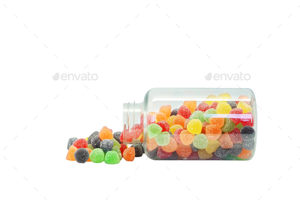Colourful tiny gummy jellies coming out from a lying jar Stock Photo by ...
