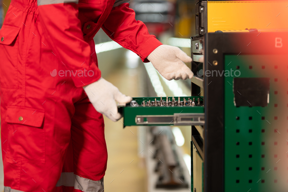 Picture of engineer using repair tools of the electric train industry ...