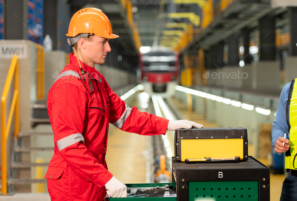 Electric train engineer and technician using repair tools of the ...