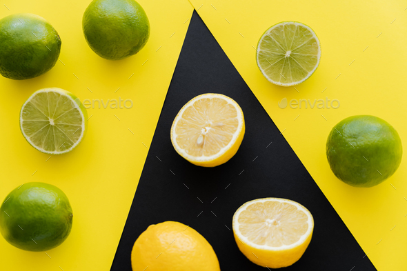 Top view of ripe limes yellow and lemons on black background Stock ...