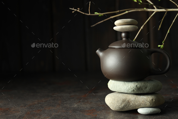 Asian tea concept, teapot on dark background. Stock Photo by AtlasComposer