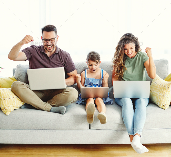 child laptop family computer woman mother father happy home man ...