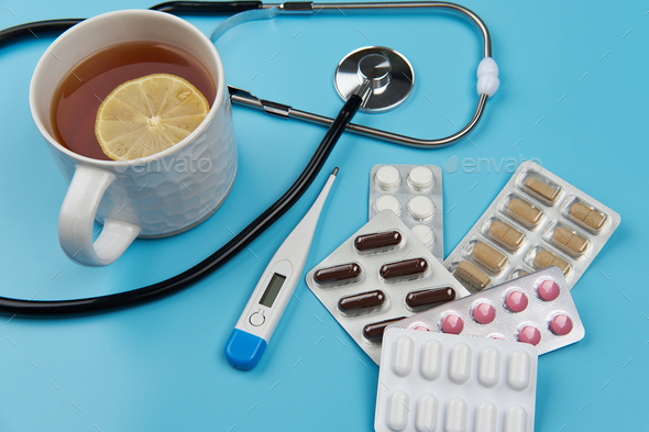 Healthcare, medicine, flu and treatment concept. Tea, stethoscope with ...