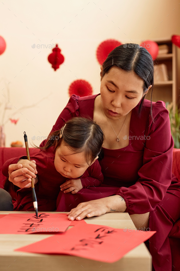 Mother and Daughter doing Calligraphy Stock Photo by seventyfourimages