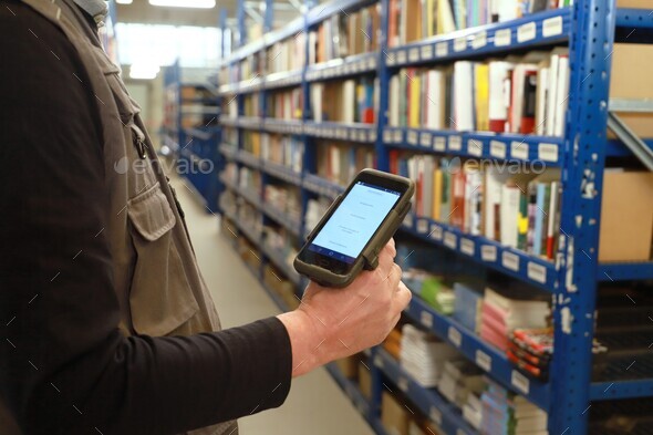 logistics warehouse - operator with a scanner in his hand Stock Photo ...