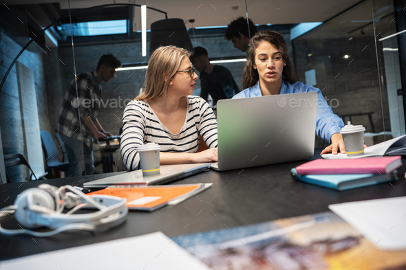 Programmers work alongside their colleagues in an office Stock Photo by ...
