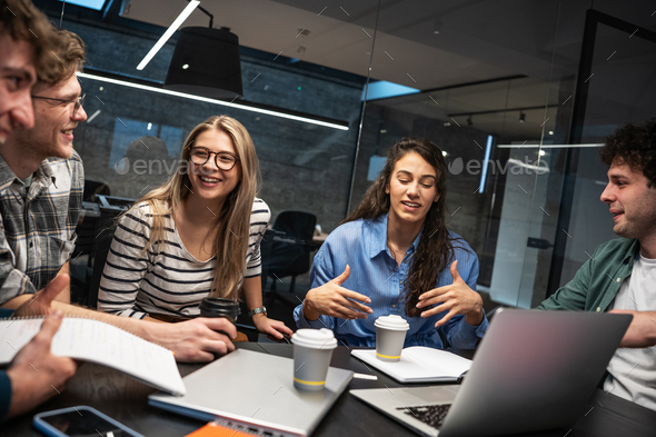 Programmers work alongside their colleagues in an office Stock Photo by ...