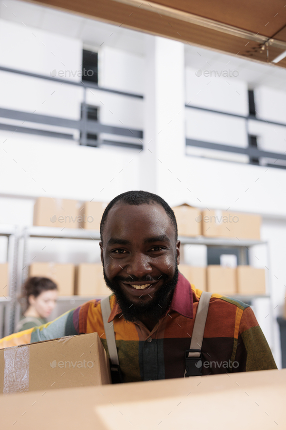 Smiling african american manager working at customers order Stock Photo ...
