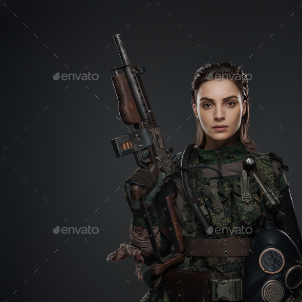 Portrait of a female soldier holding a homemade automatic rifle Stock ...