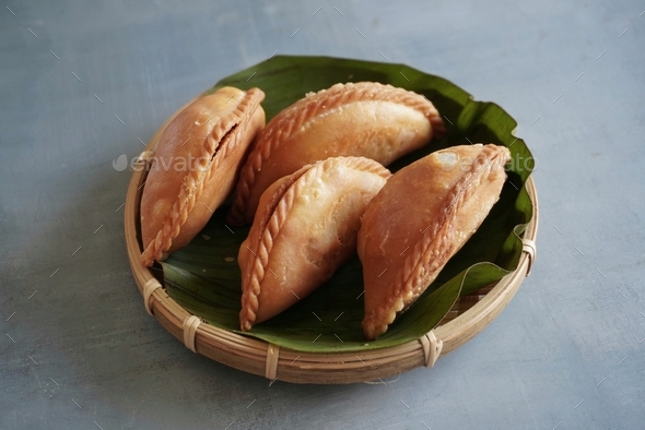 Close up image of Malaysian traditional snack karipap. Stock Photo by ...